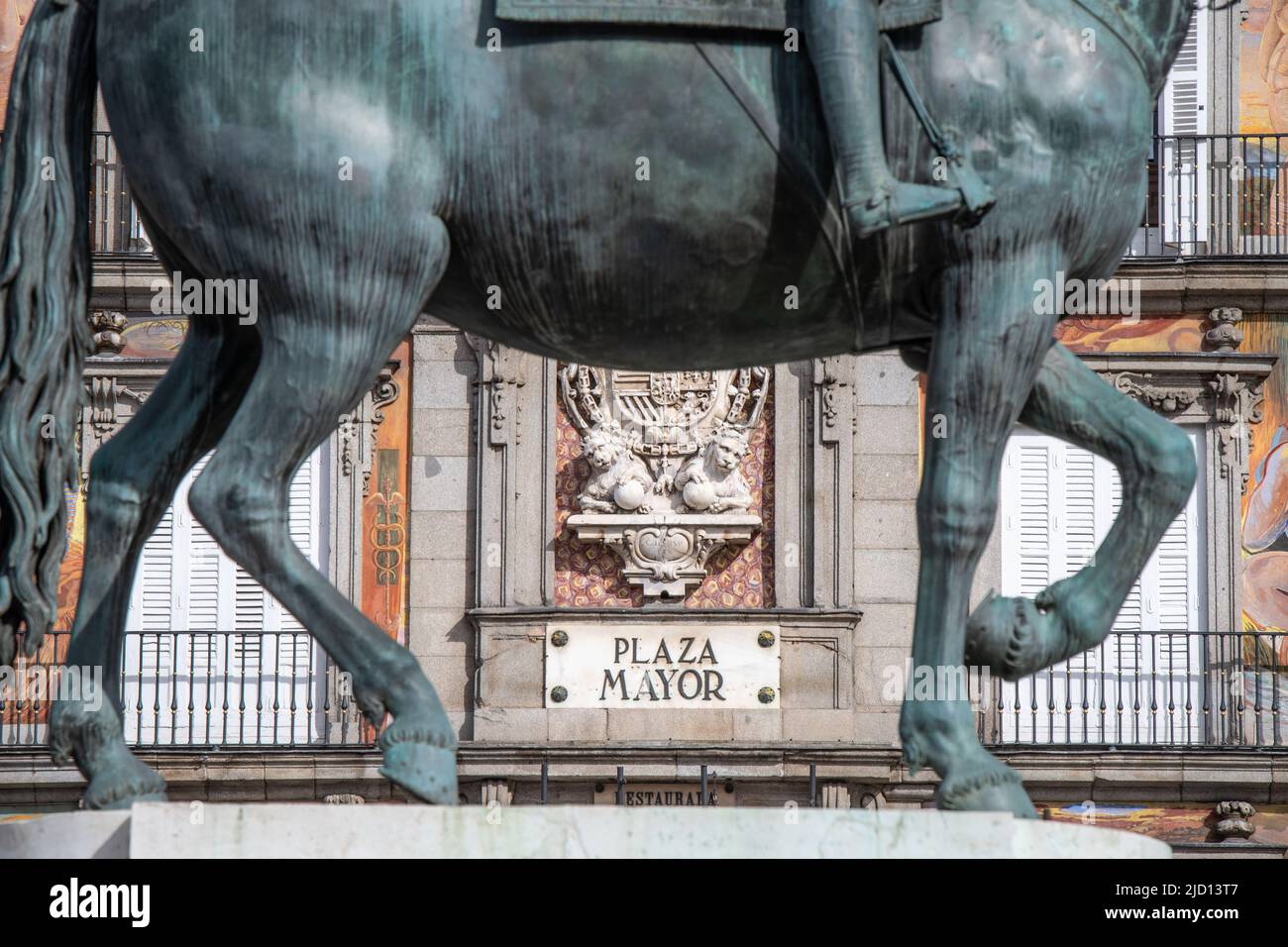 A sign for Plaza Mayor beyond the statue of Philip III, Madrid, Spain ...