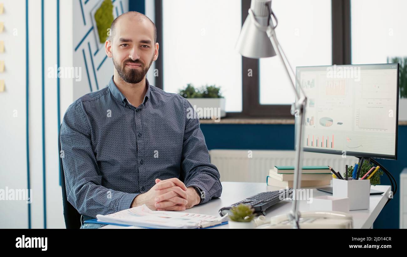 Portrait of business man working with data sales report, planning ...