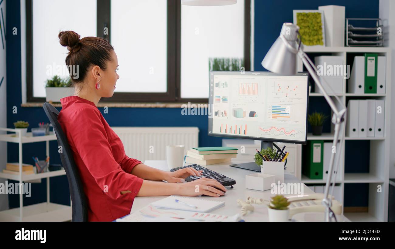 Company accountant working with sales analysis on computer, using data ...