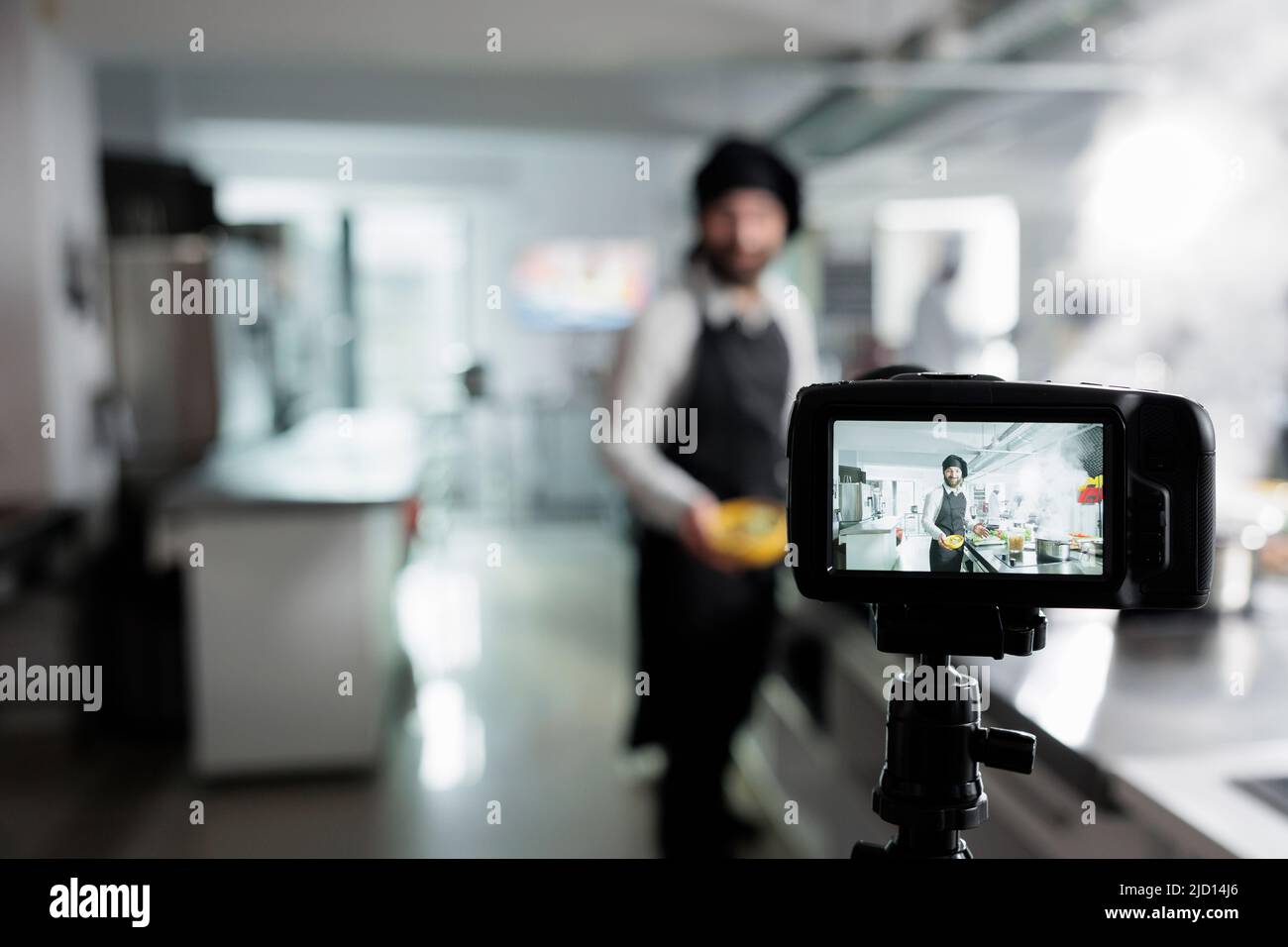 Close up of camera recording head chef cooking delicious fine dining ...