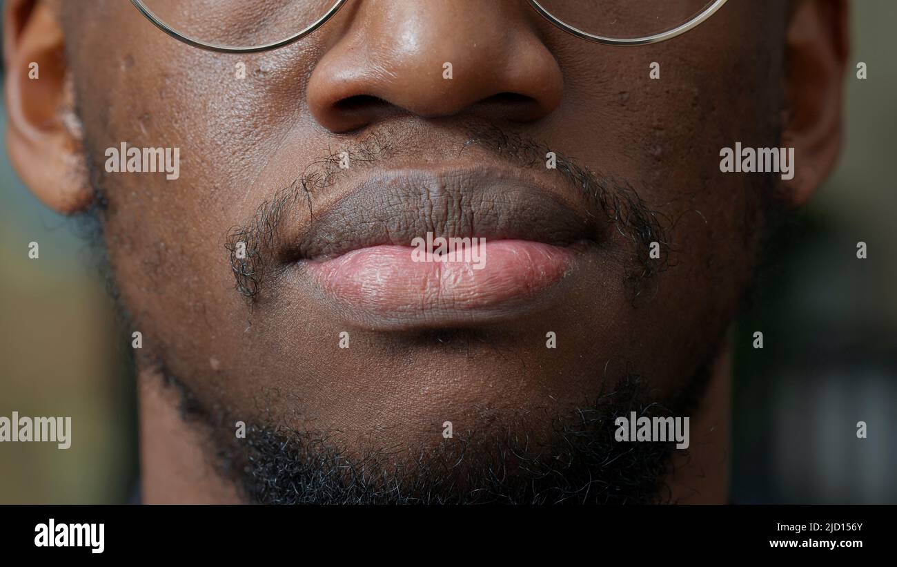 Macro shot of male model showing candid smile on camera, having ...