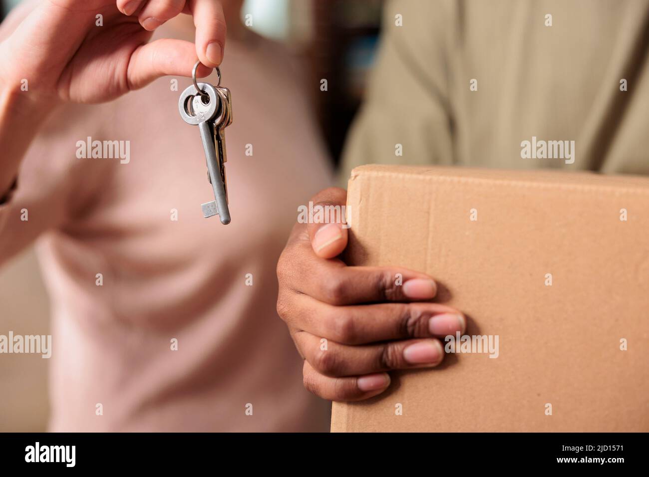 Diverse life partners buying first house together and having keys ...