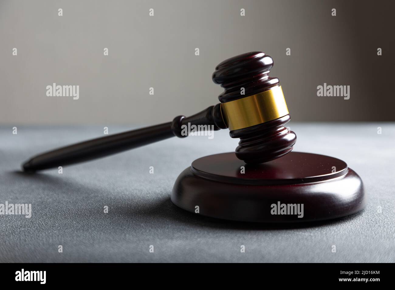 Law theme, mallet of the judge on wooden desk with Lady Justice Statue ...