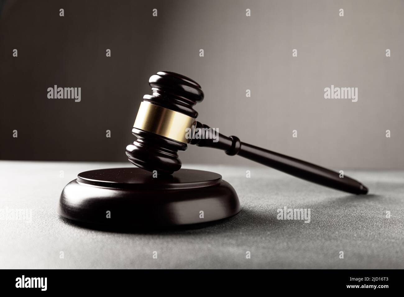 Law theme, mallet of the judge on wooden desk with Lady Justice Statue ...