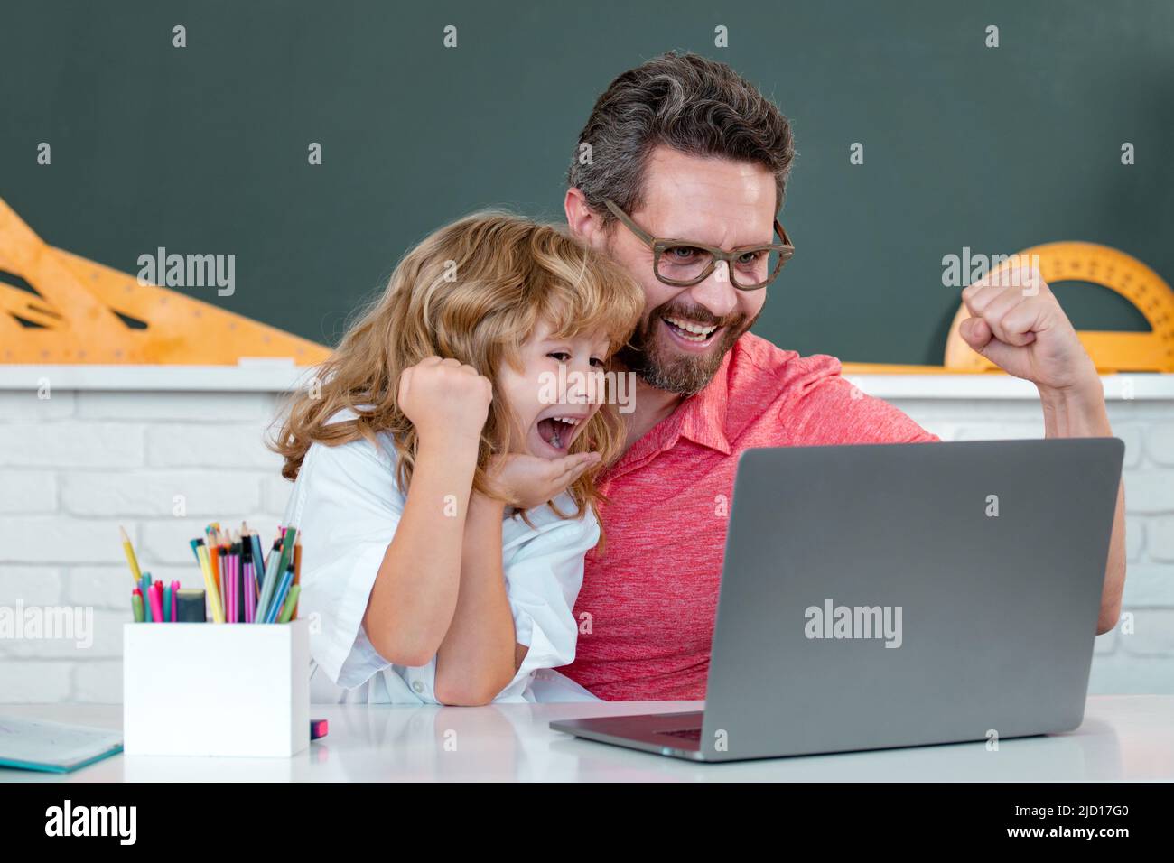 Pupil kid student and teacher tutor in classroom at school lesson ...