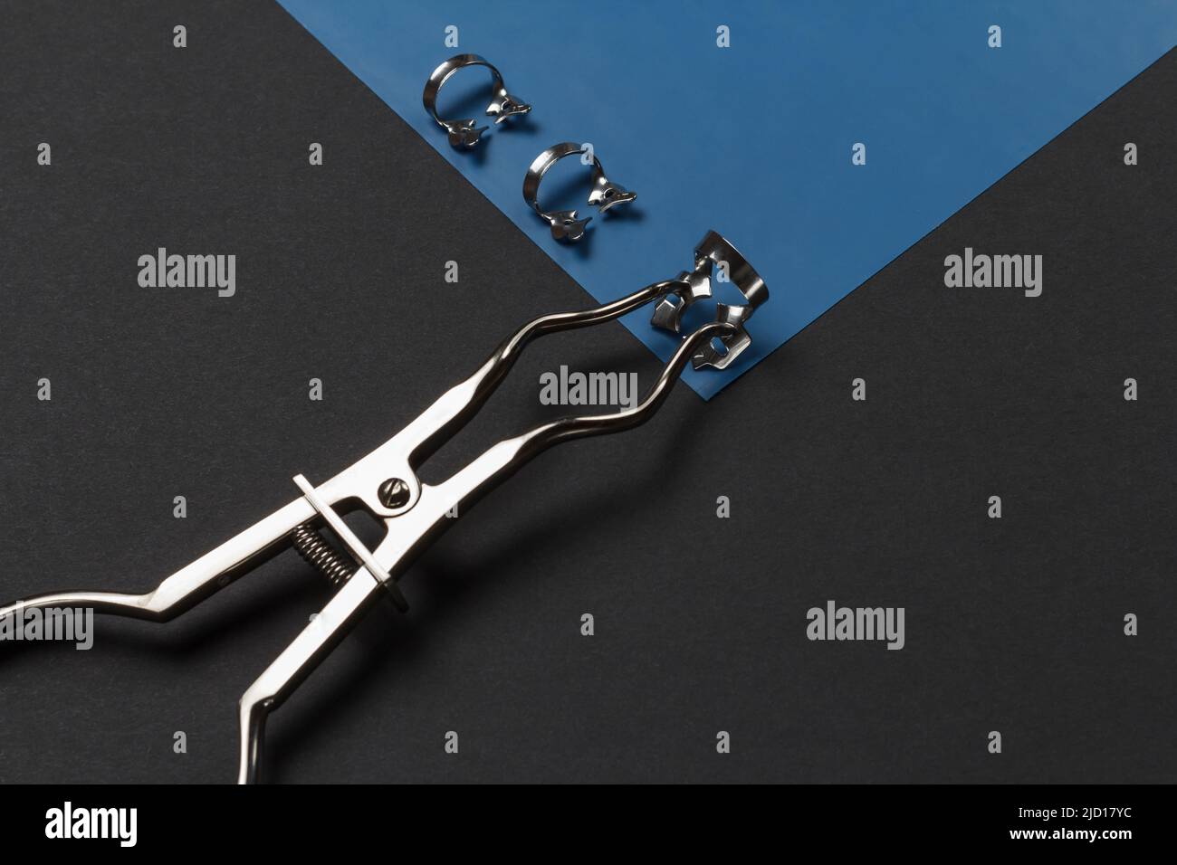 Rubber dam with dental dam clamps and a rubber dam clamp pliers on the ...