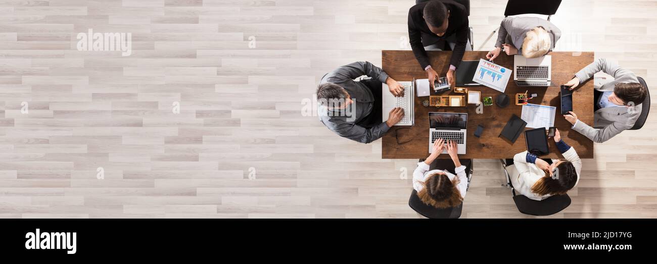 Overhead View Of Diverse Businesspeople Working At Workplace In Office ...