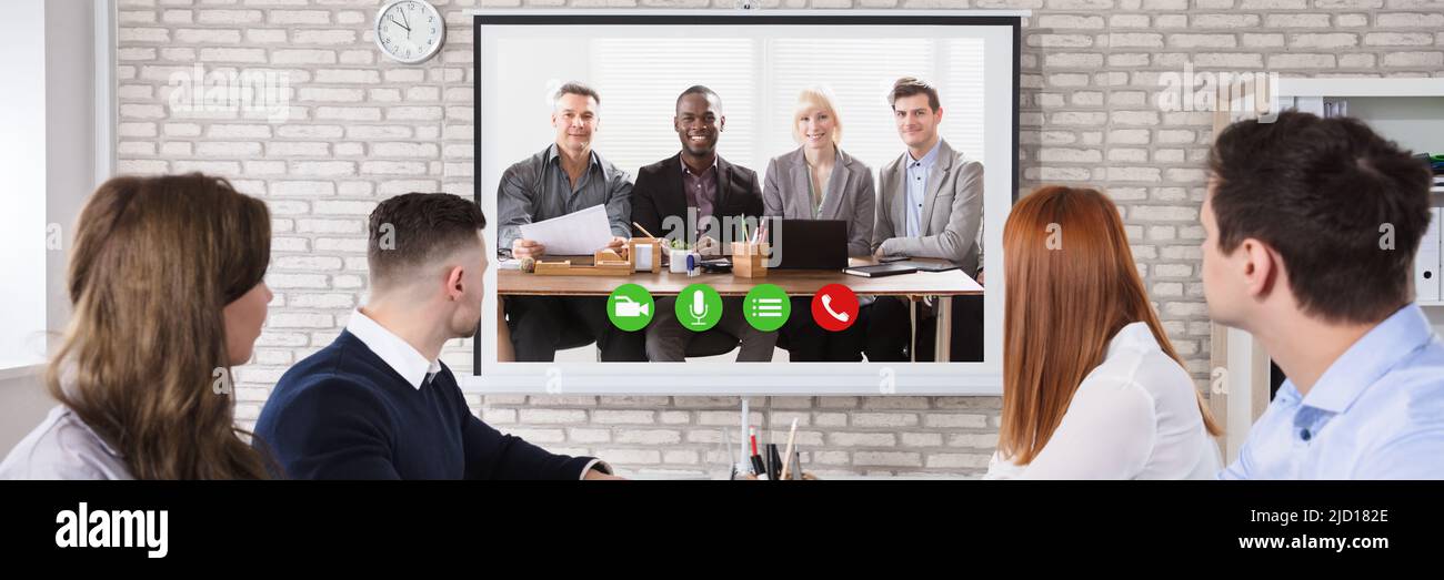 Group Of Business People Doing Video Conferencing In Business Meeting ...