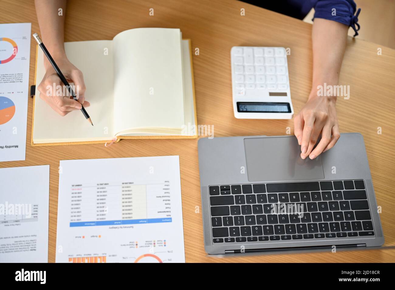 Overhead shot, An office desk workspace with portable notebook laptop ...