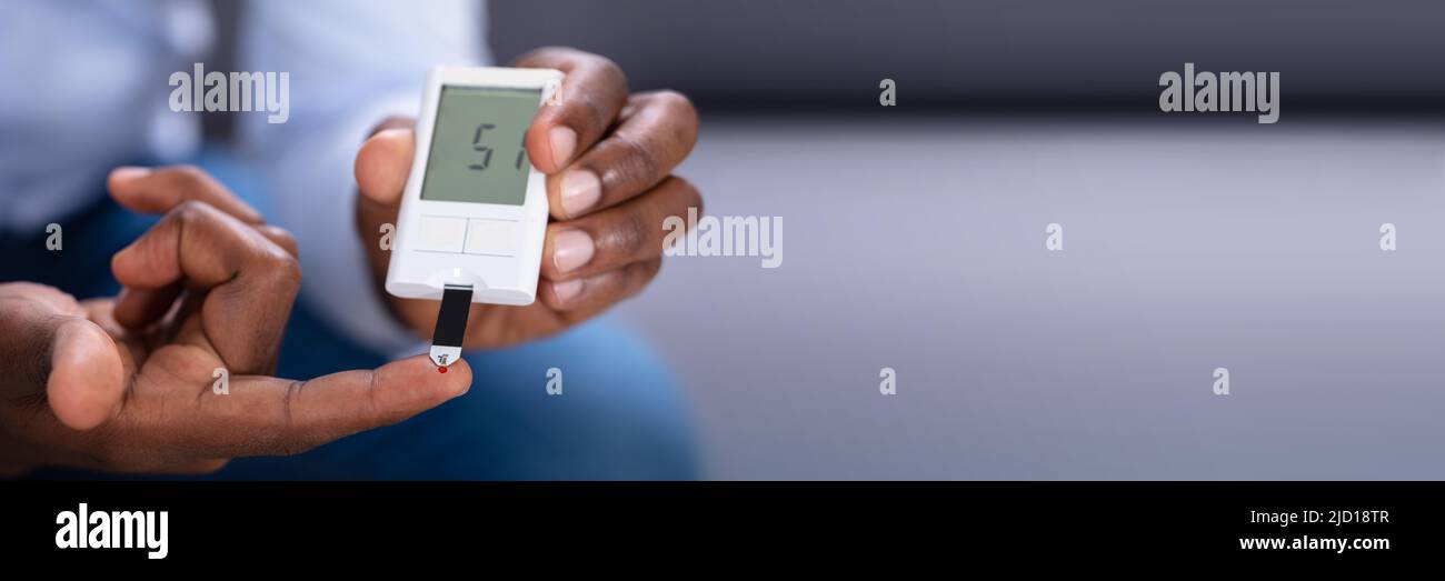 Close-up Of A Man's Hand Checking Blood Sugar Level With Glucometer ...