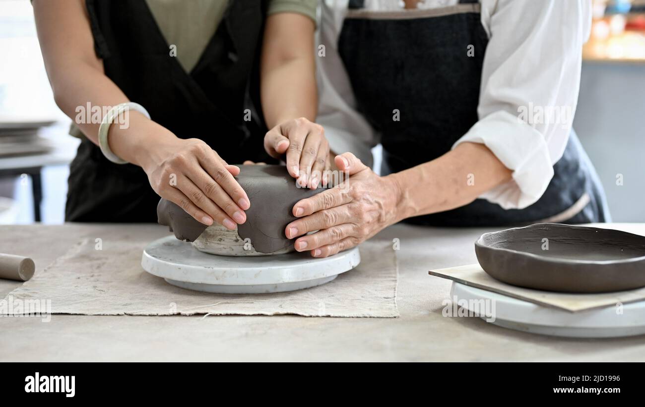 Hands moulding clay hi-res stock photography and images - Alamy