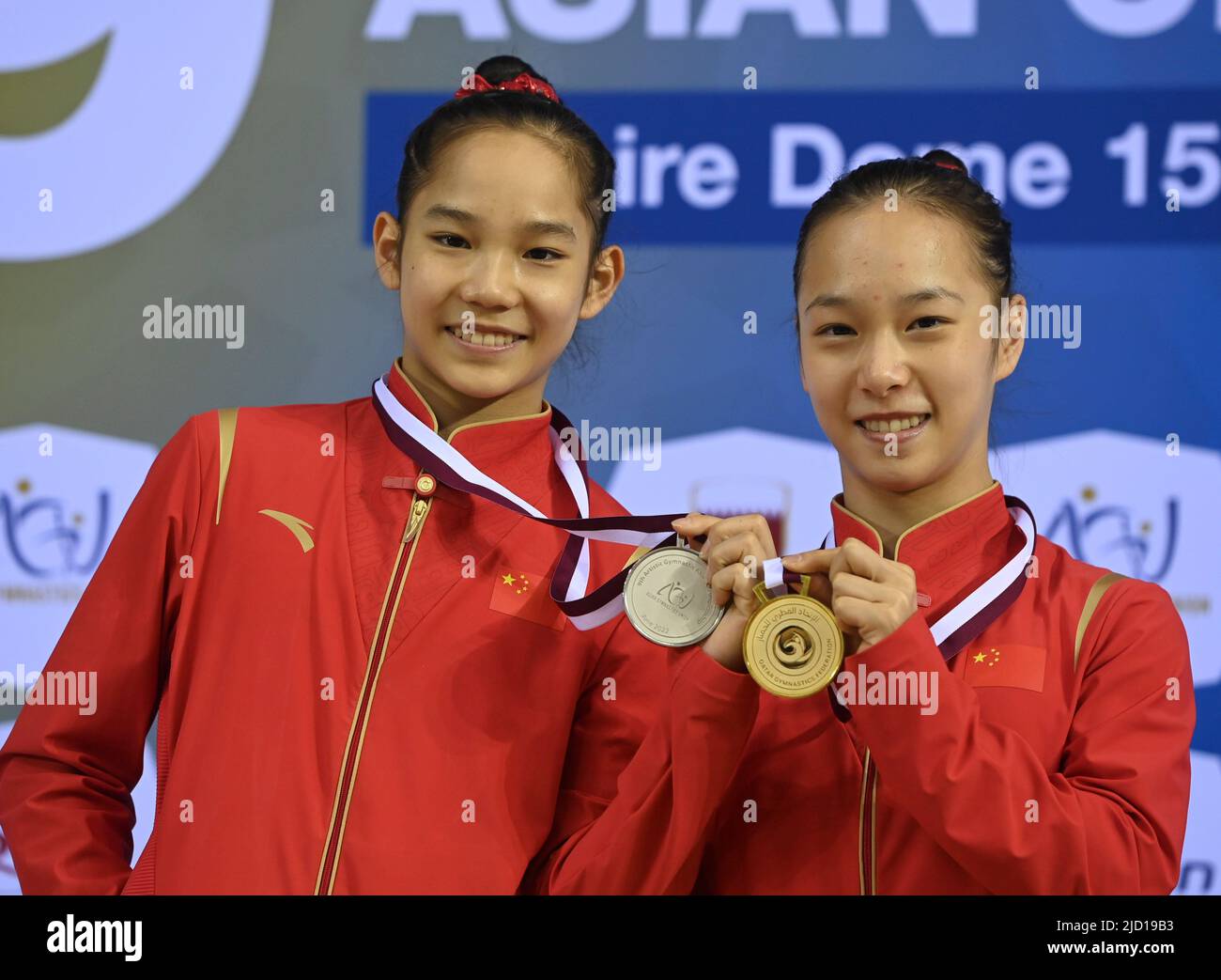 Doha. 16th June, 2022. Tang Xijing (L) and Zhang Jin of China pose with ...