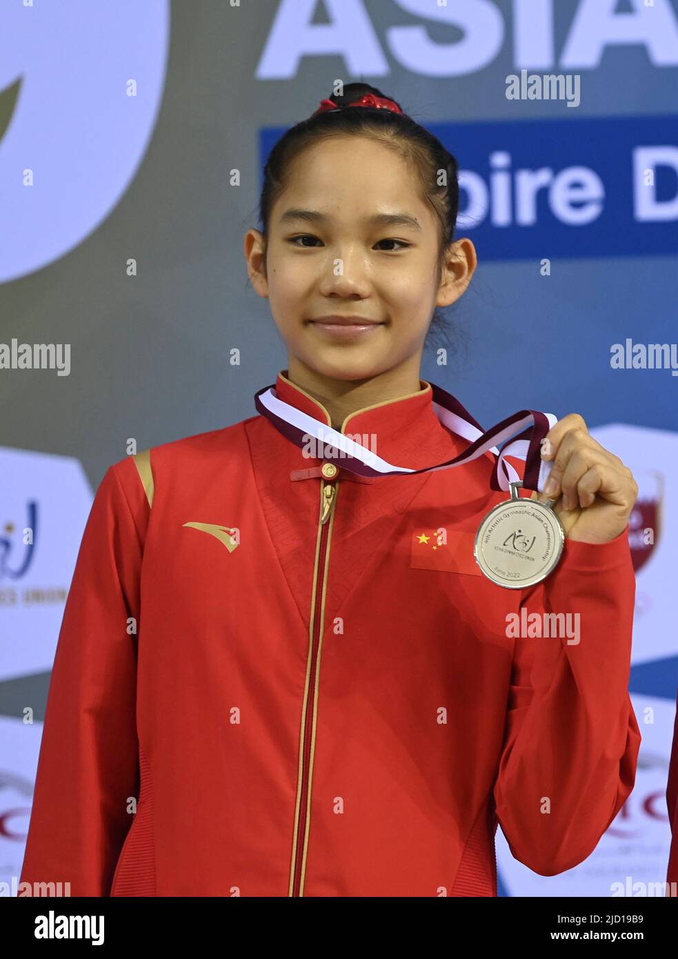 Doha. 16th June, 2022. Tang Xijing of China poses with the medal during ...