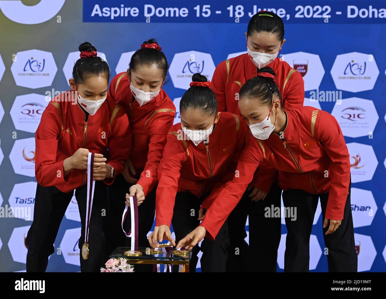 Doha, Sun Xinyi and Zhang Jin (from L to R) of China react during the ...