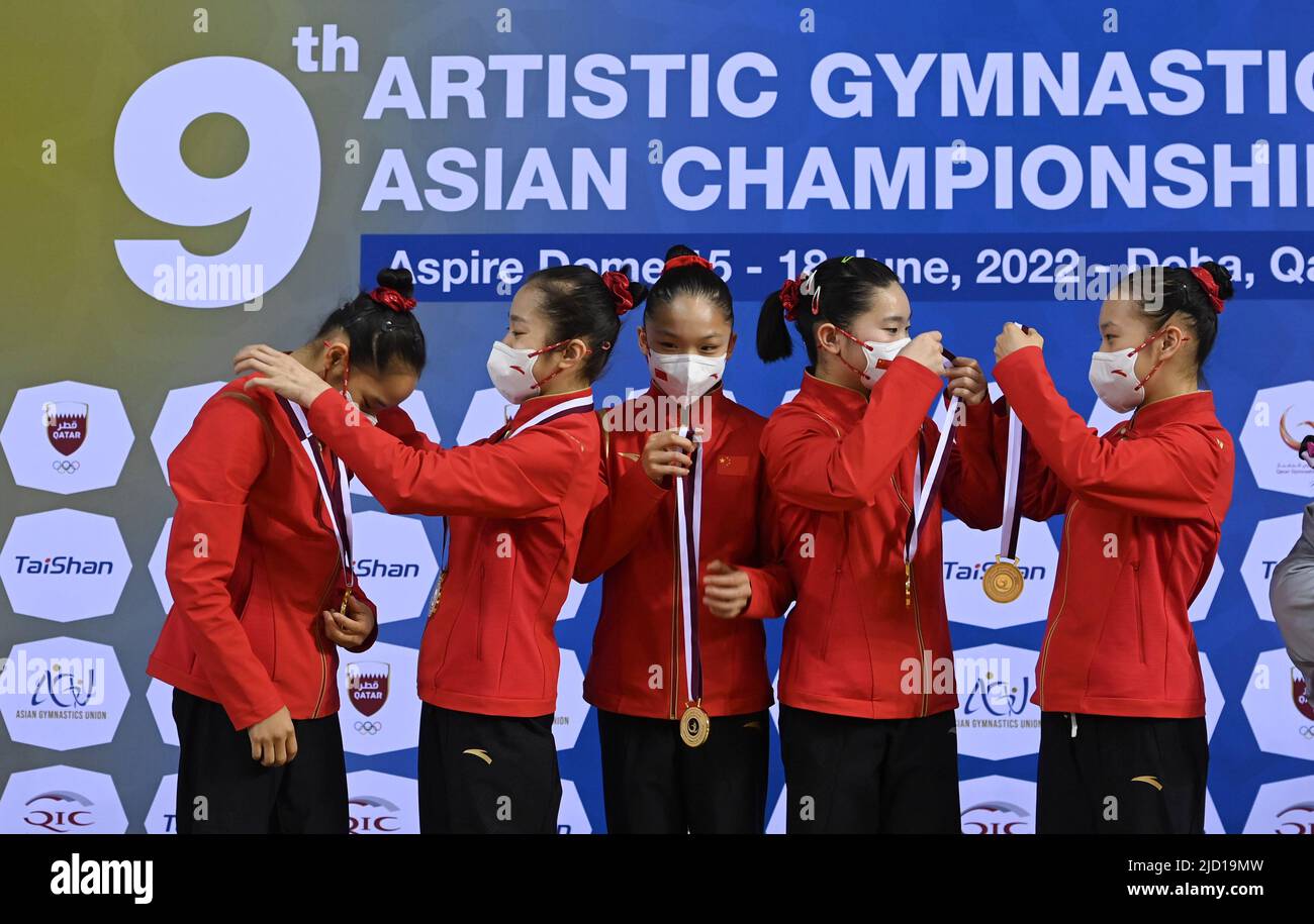 Doha, Sun Xinyi and Zhang Jin (from L to R) of China react during the ...