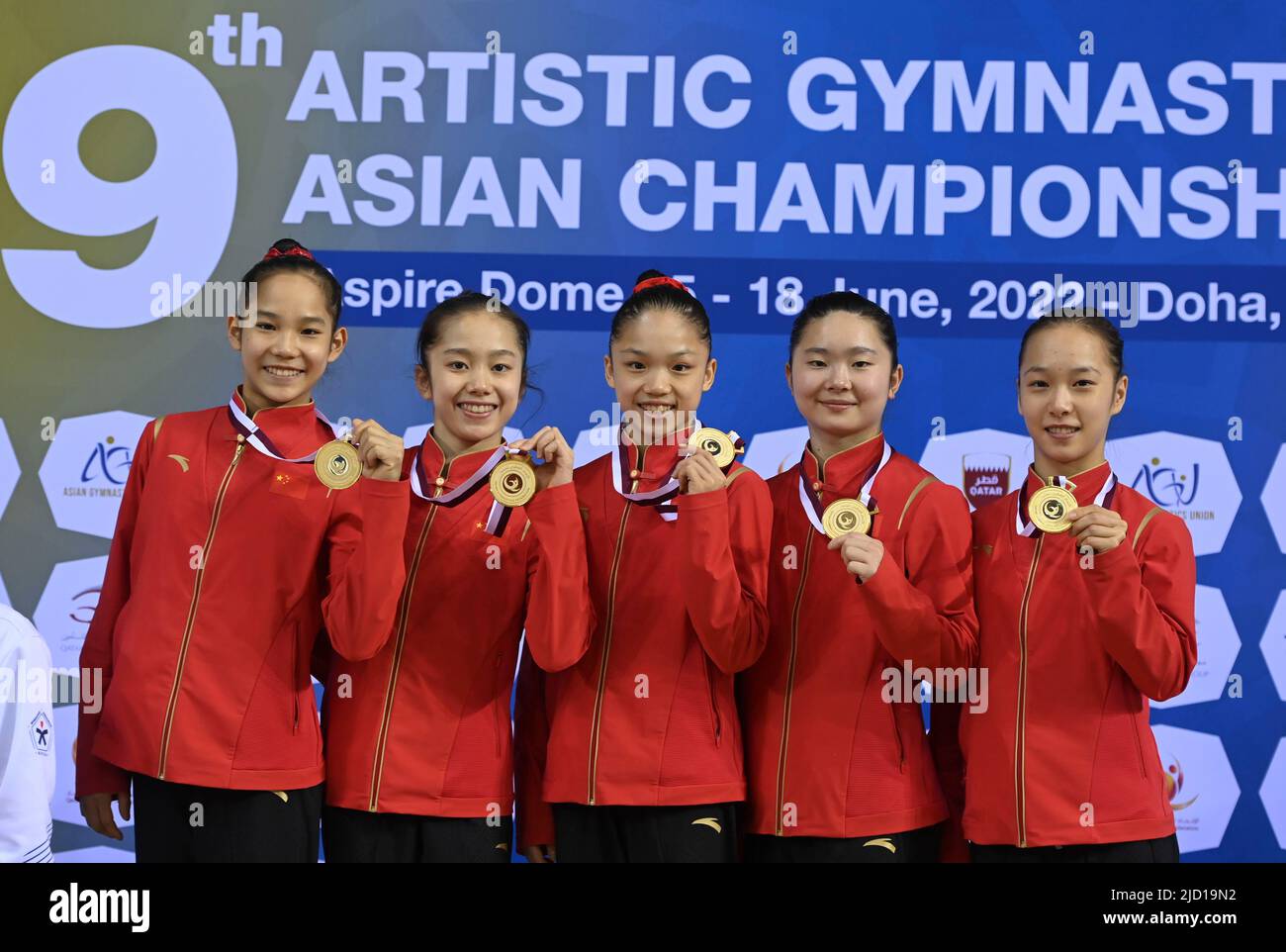 Doha, Sun Xinyi and Zhang Jin (from L to R) of China react during the ...