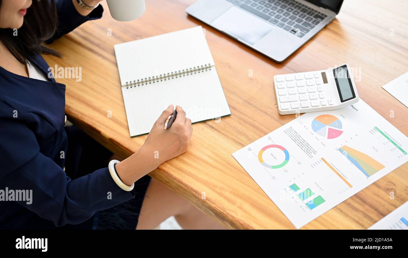 Overhead shot, Businesswoman or female financial worker working at her ...