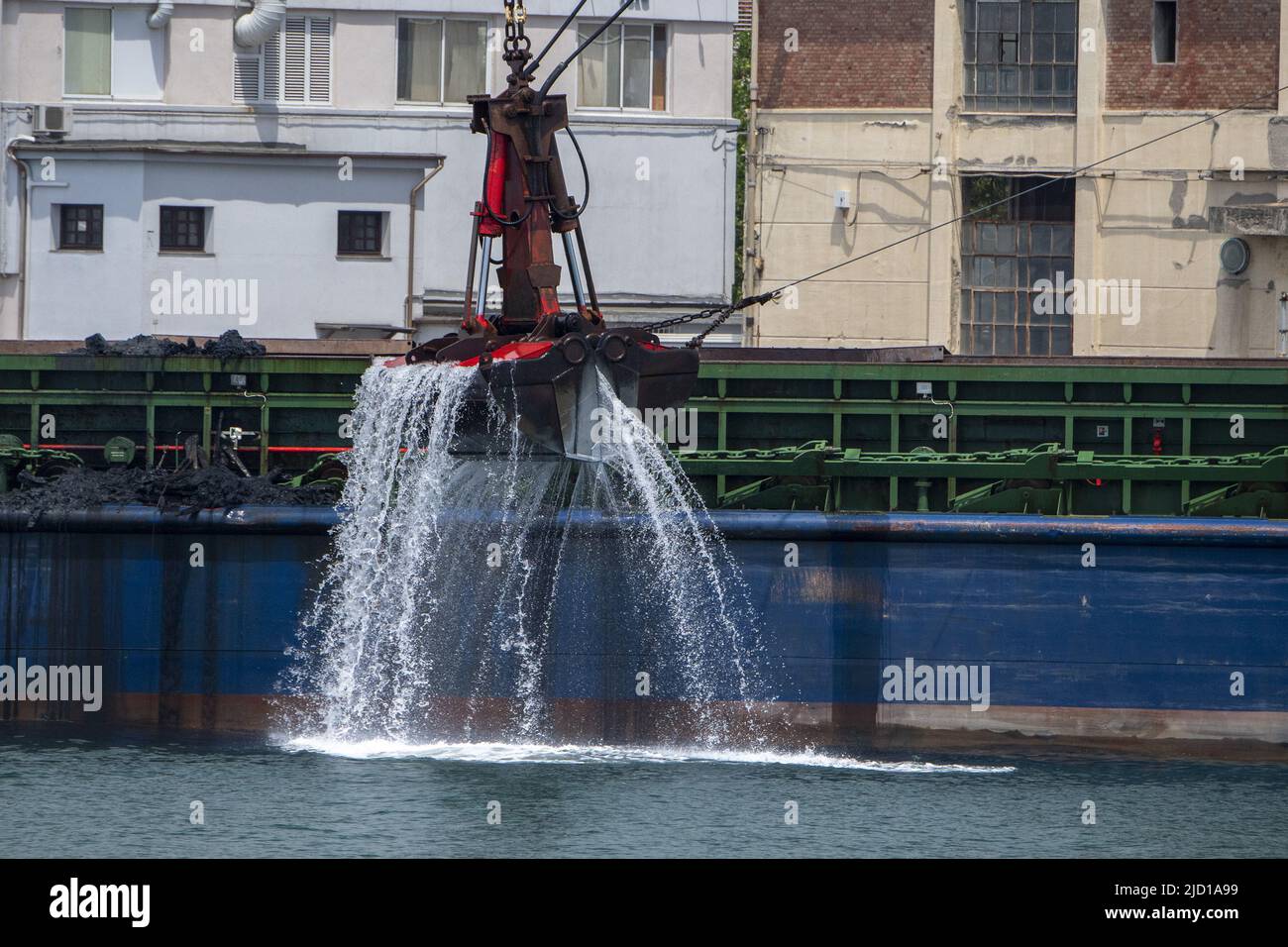 Harbor dredge while working detail Stock Photo - Alamy