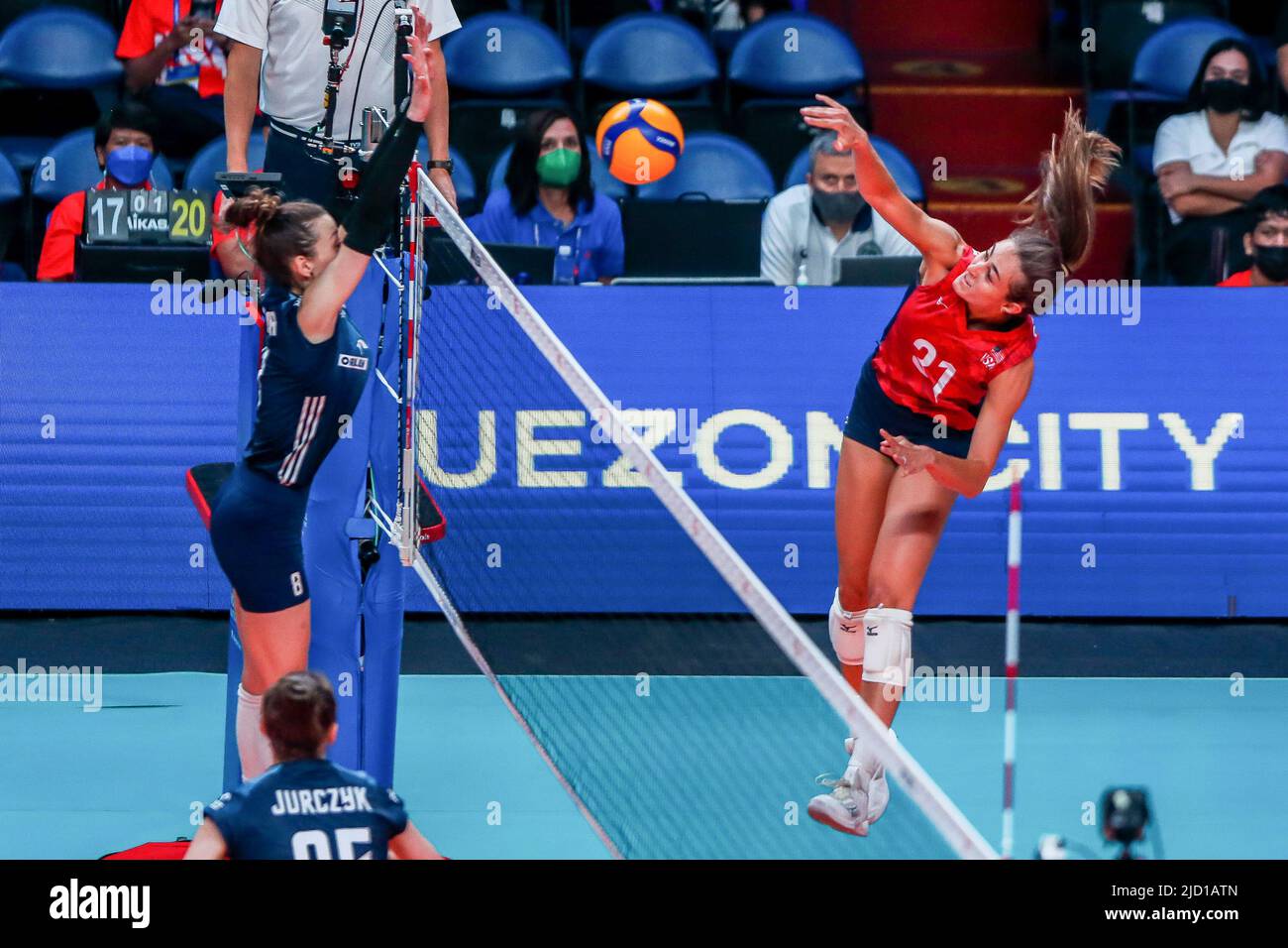 Quezon City. 17th June, 2022. Anna Stevenson (R) spikes during the FIVB ...