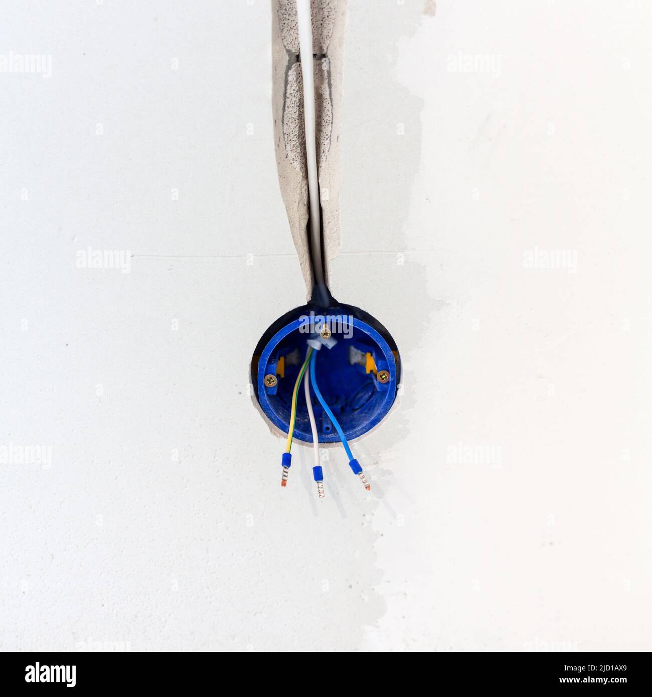 Socket and electrical wires on the wall, building new home concept ...