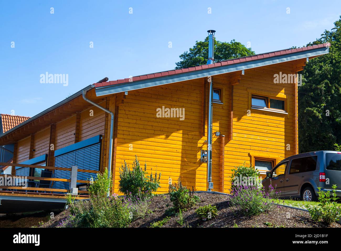 Beautiful new wooden house in a rural setting Stock Photo - Alamy