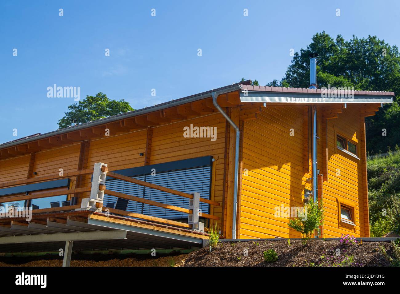 Beautiful new wooden house in a rural setting Stock Photo - Alamy