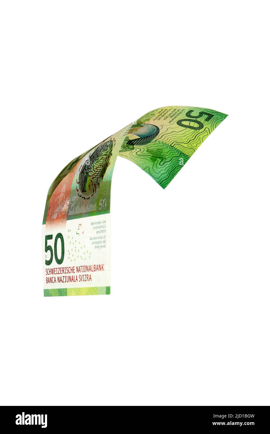Flying Swiss money isolated with clipping path Stock Photo - Alamy