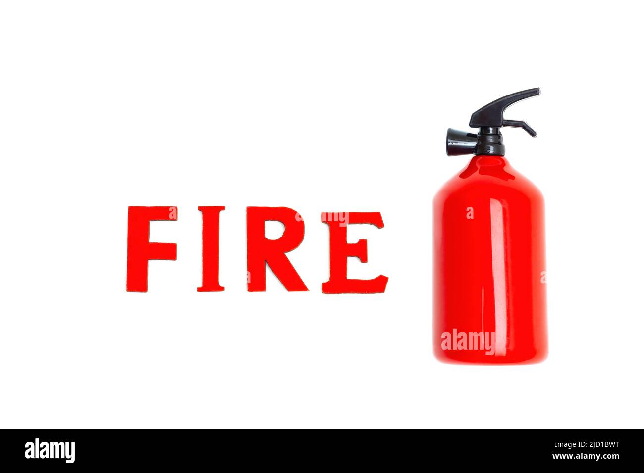 Word FIRE made from red wooden letters and a toy fire extinguisher ...