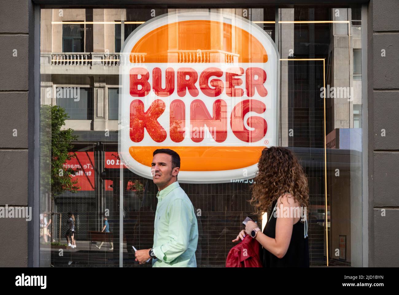 Pedestrians walk past the American chain of hamburger fast food ...