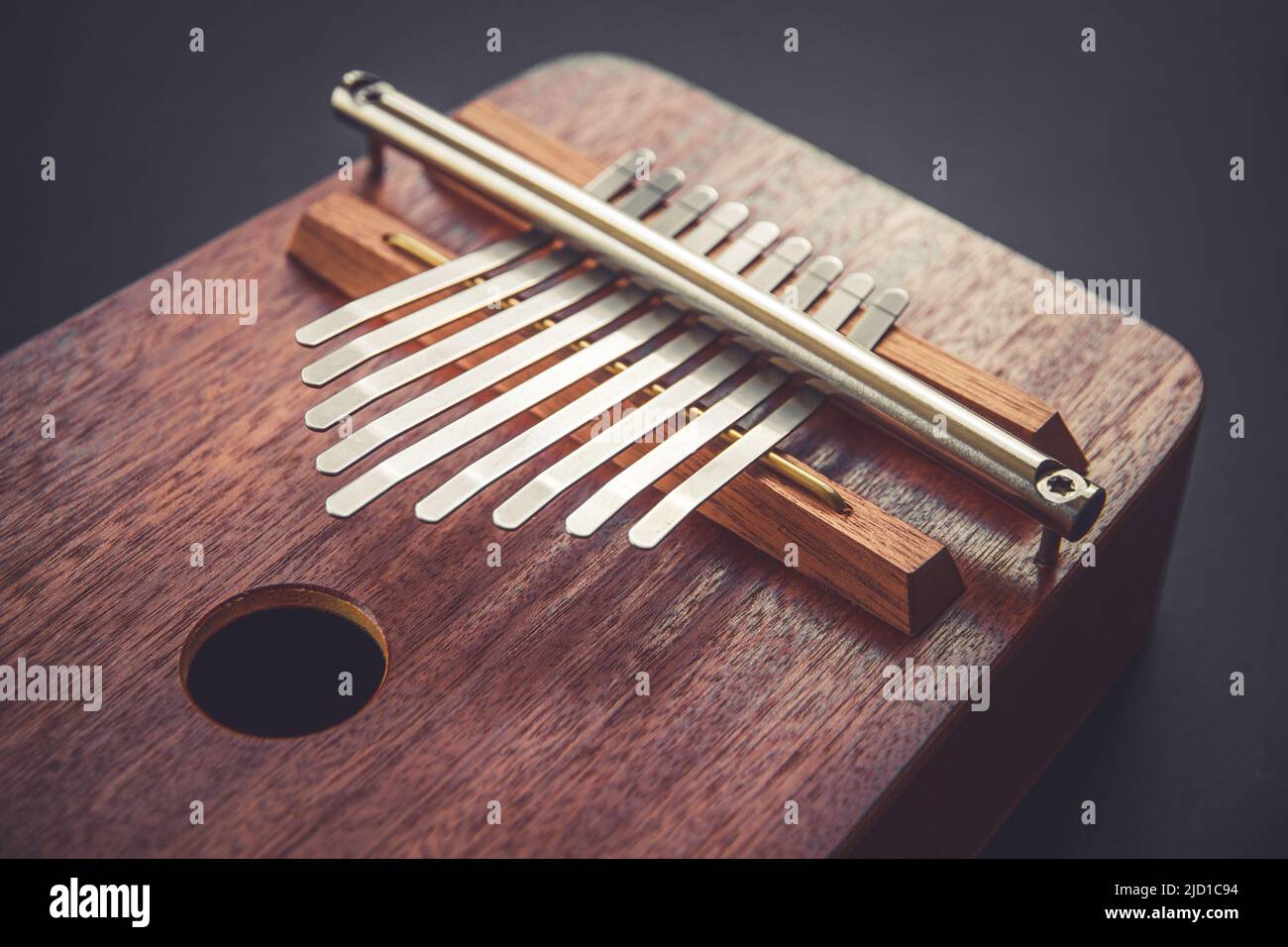 Traditional wooden kalimba isolated on black background Stock Photo - Alamy