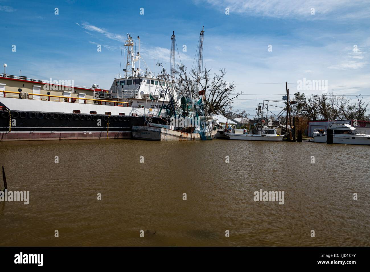 Shrimp Trawlers damaged as the crew boat drifted past them during ...