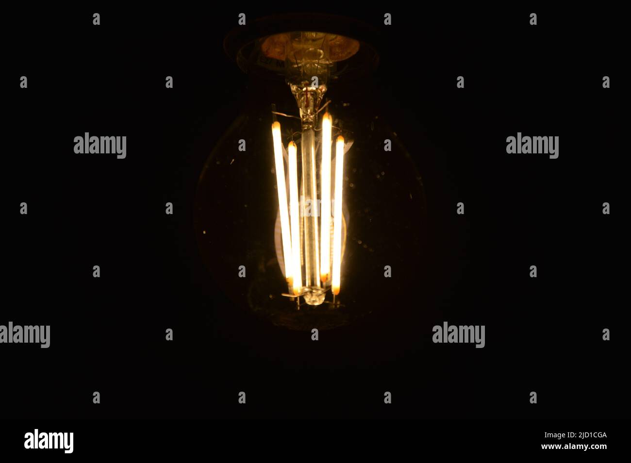Light bulb with black background Stock Photo - Alamy