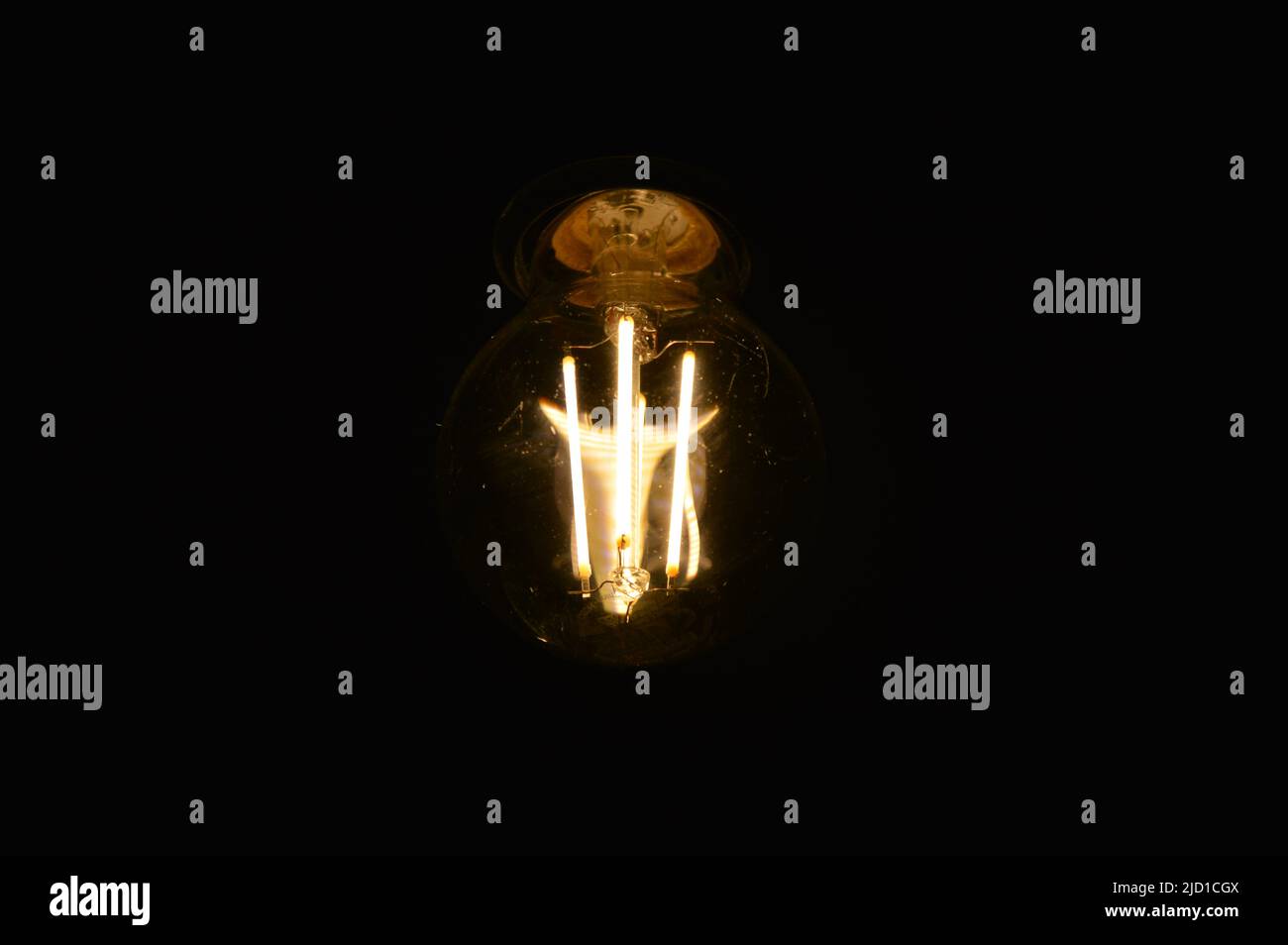 Light bulb with black background Stock Photo - Alamy
