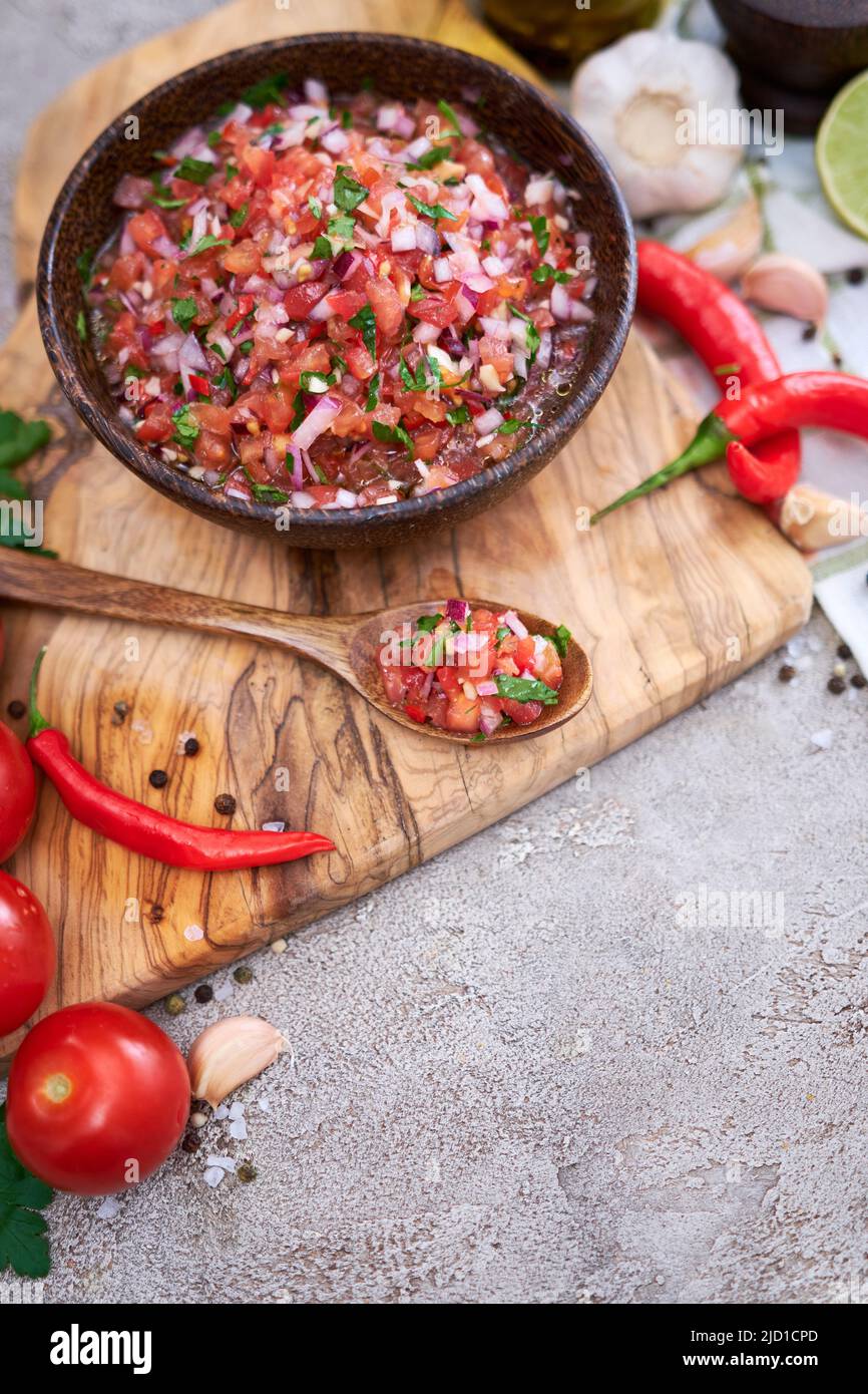 freshly made salsa dip sauce - chopped garlic, tomatoes and onion in ...