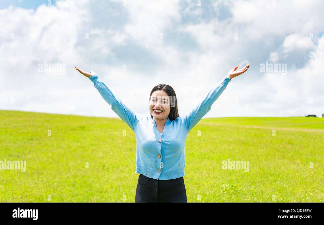 Attractive Girl Spreading Her Arms In The Field Smiling Young Woman Spreading Her Arms In The