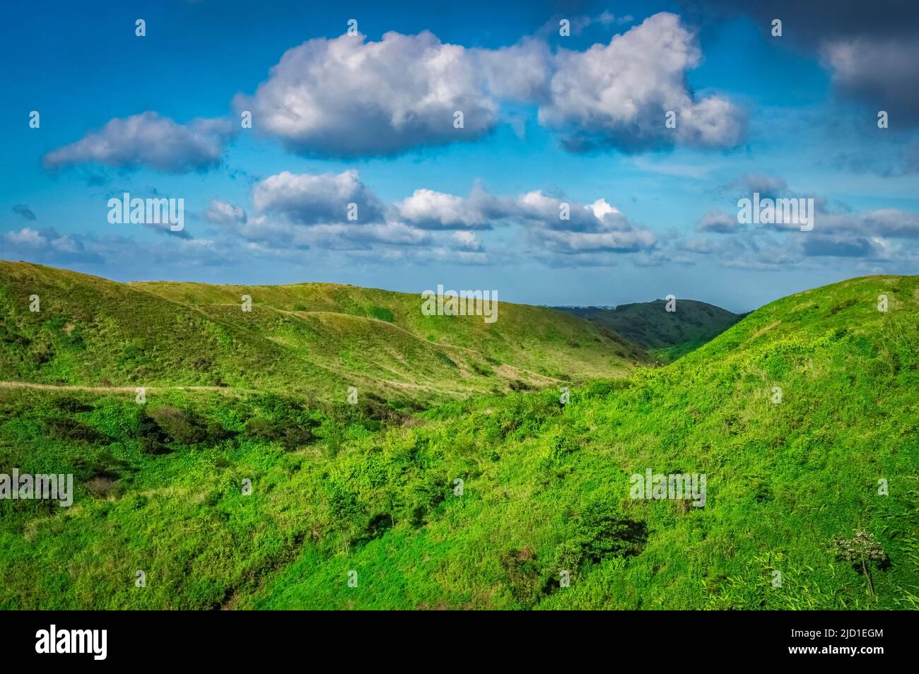 Hills with clouds and blue sky, hills and blue sky with copy space ...