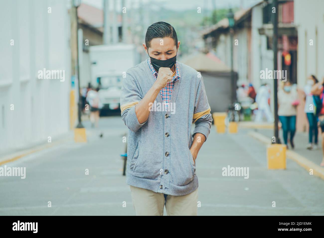 Coughing man with surgical mask, man with mask coughing in the street ...