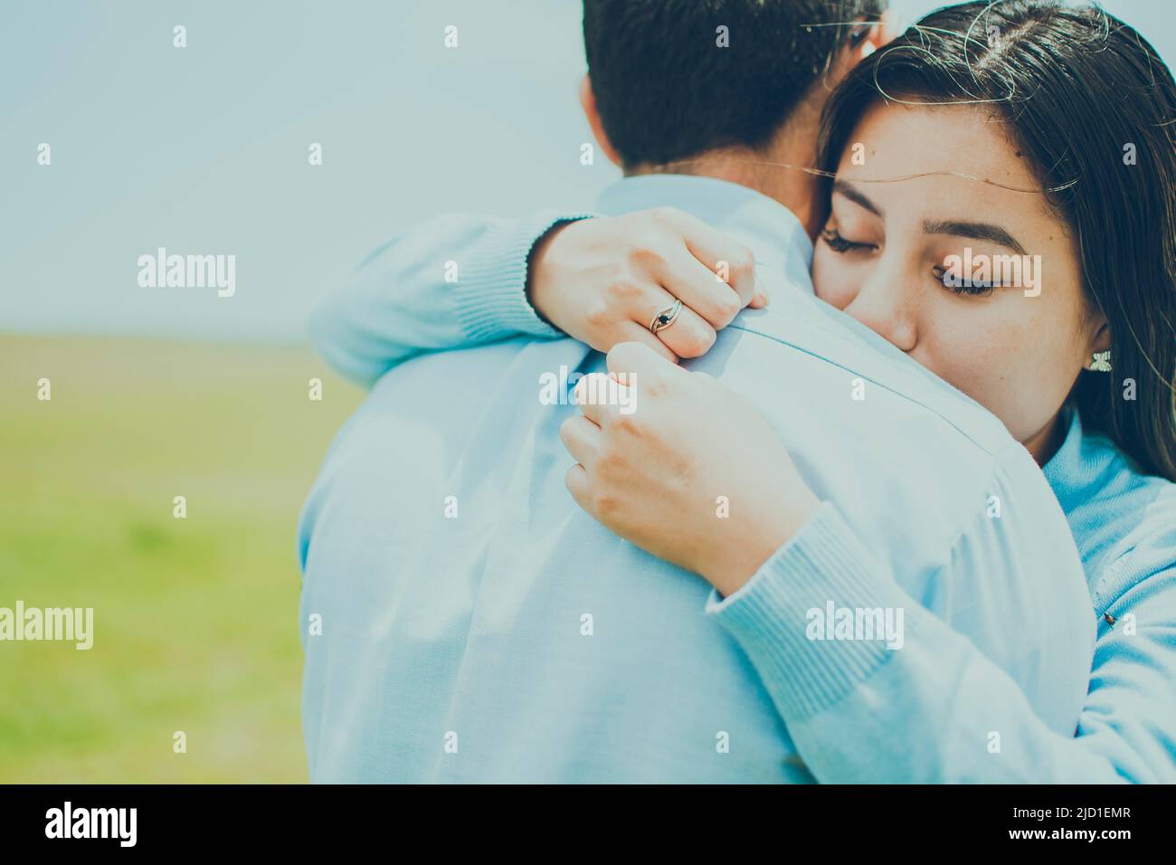 Concept of a couple lovingly embracing each other in the field, Close ...