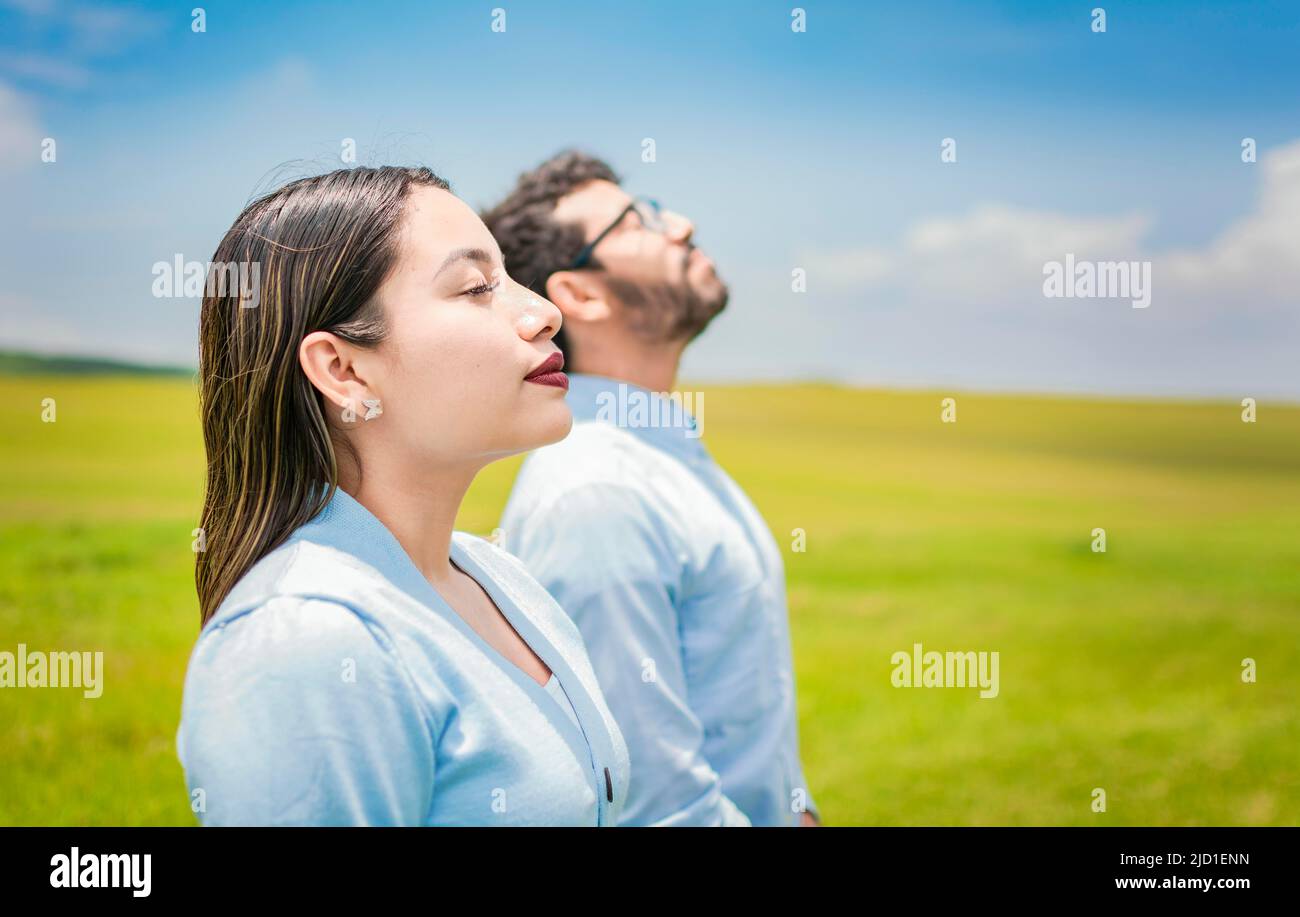 Young couple breathing fresh air in the field, Concept of Young couple ...
