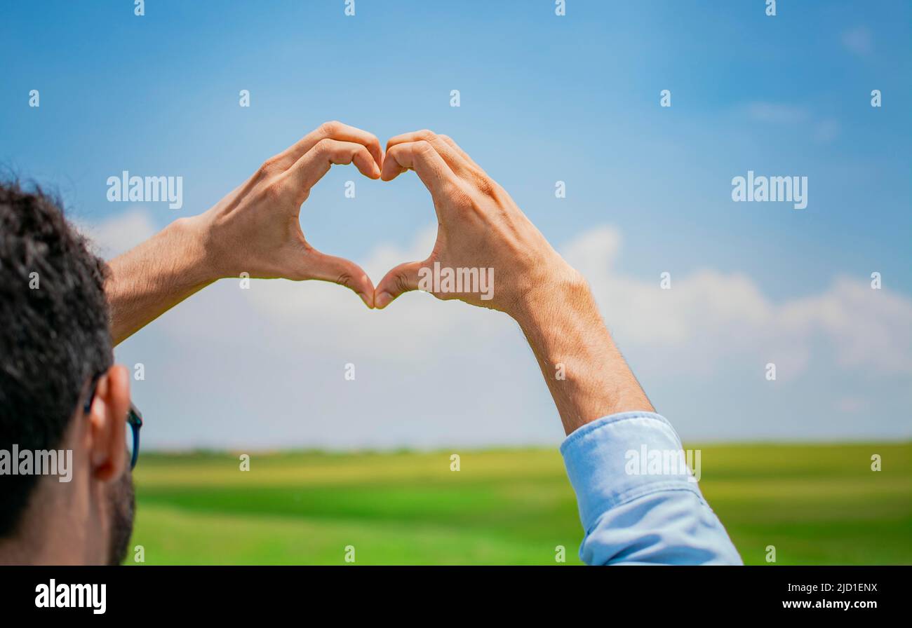 Hands together in the shape of a heart, man's hands together in the ...