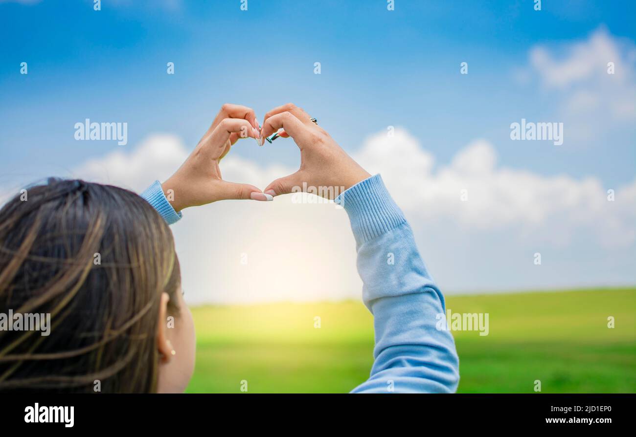 Hands together in a heart shape, woman's hands together in a heart ...