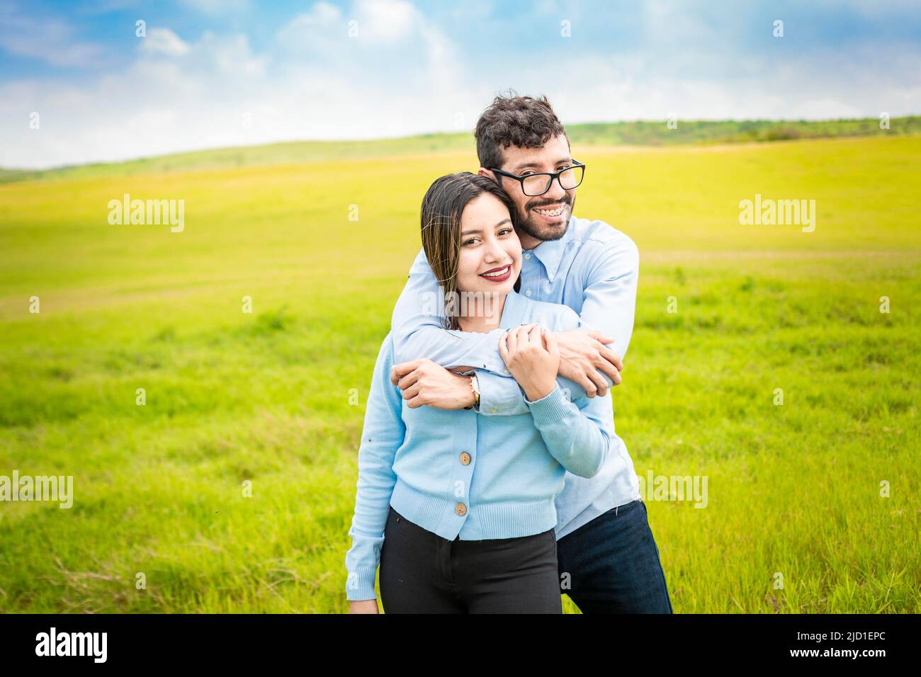 Portrait of a happy couple hugging in the field, Portrait of a young ...
