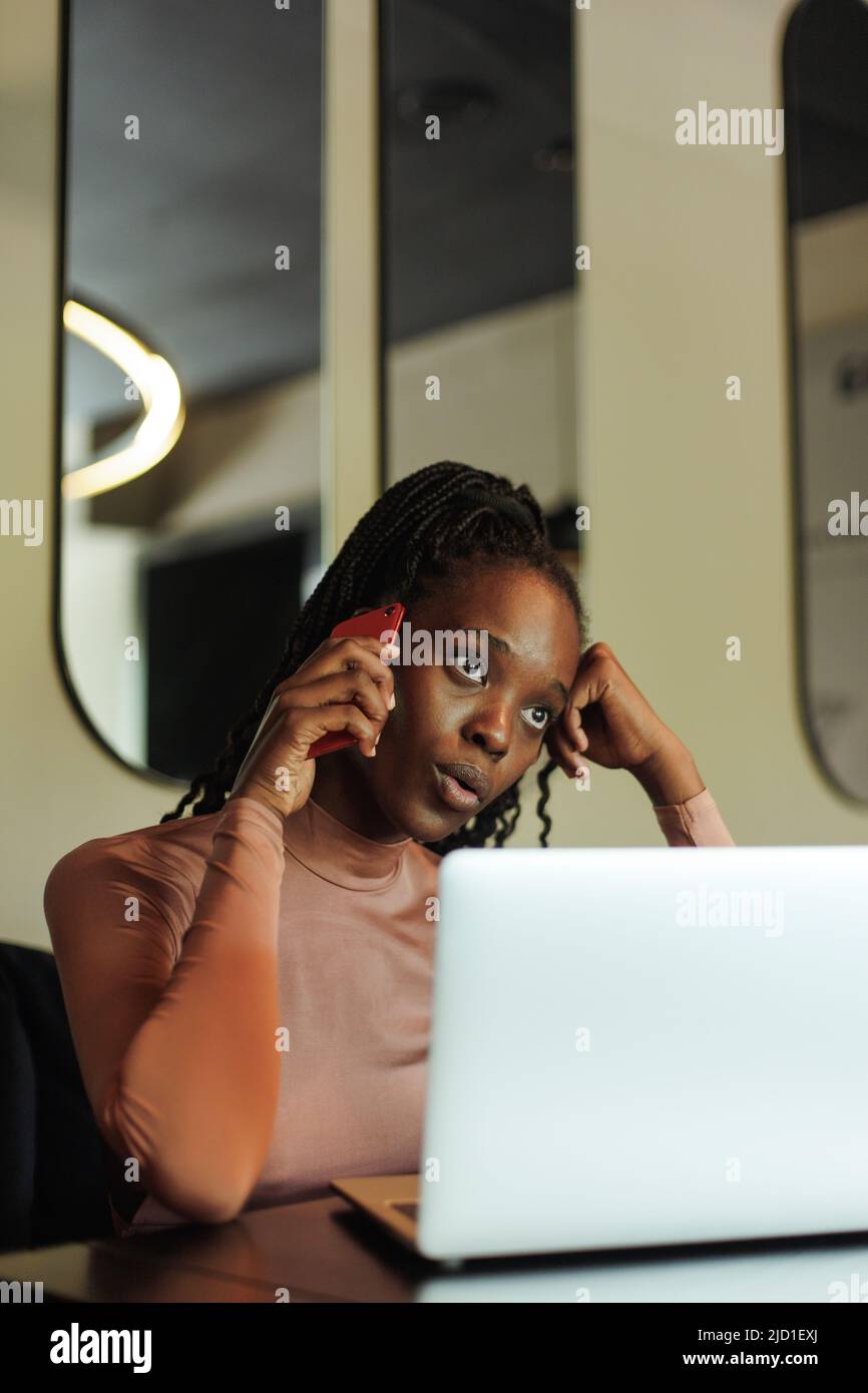 Vertical closeup unhappy multiethnic business woman talk phone. Bad ...
