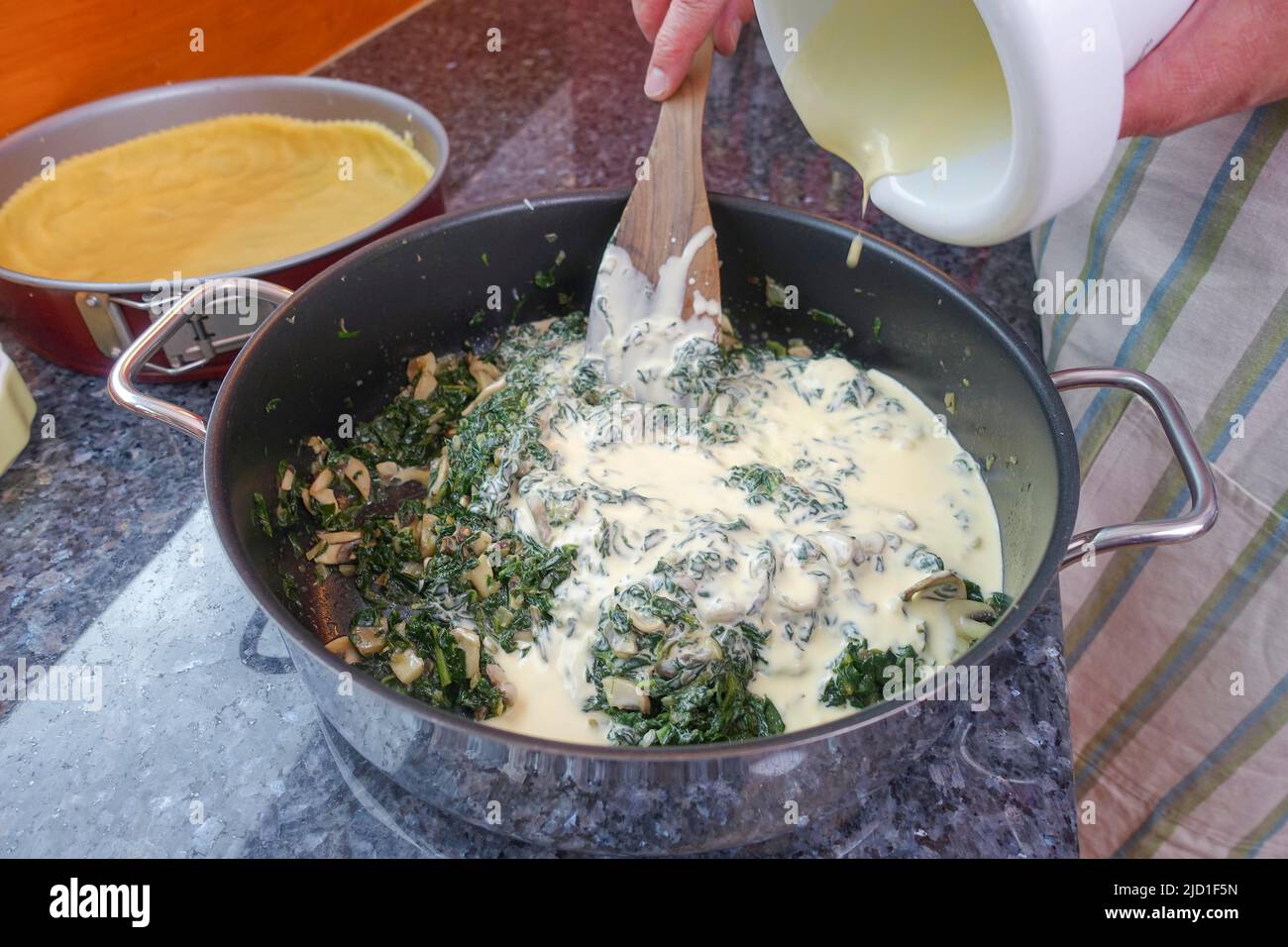Swabian cuisine, preparing spinach cake with shortcrust pastry base ...