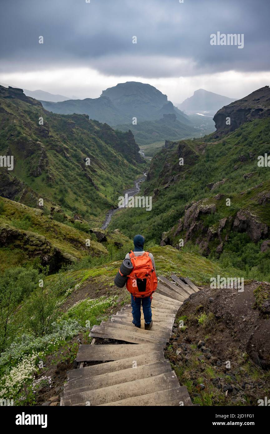 Hikers on hiking trail with steps, mountain landscape with river valley ...