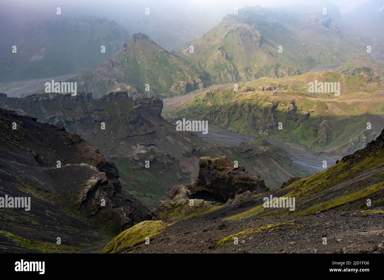 View of rugged mountain landscape, tufa rock formations, river Hrauna ...