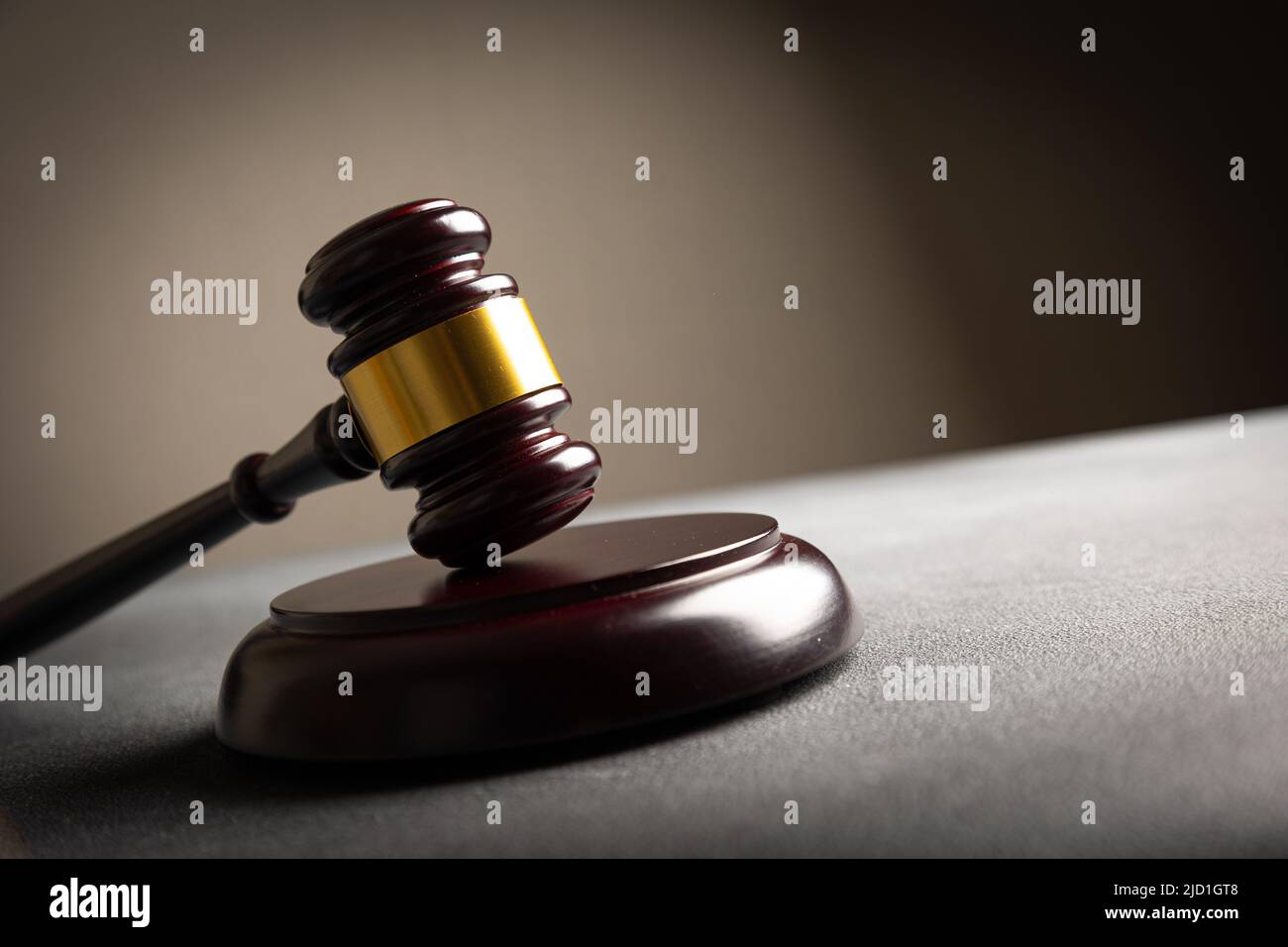 Law theme, mallet of the judge on wooden desk with Lady Justice Statue ...