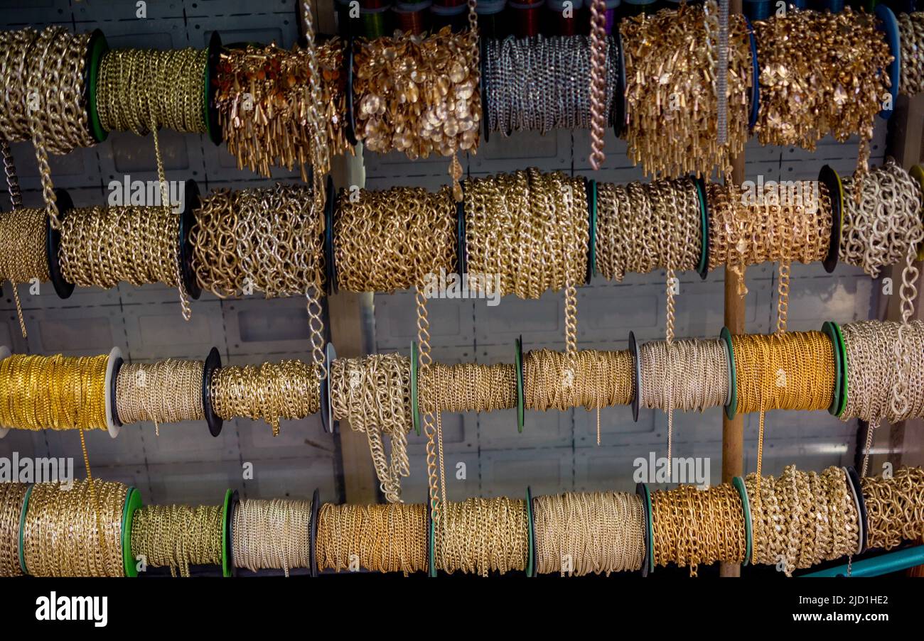 Rolls of metal chains as a background texture Stock Photo - Alamy