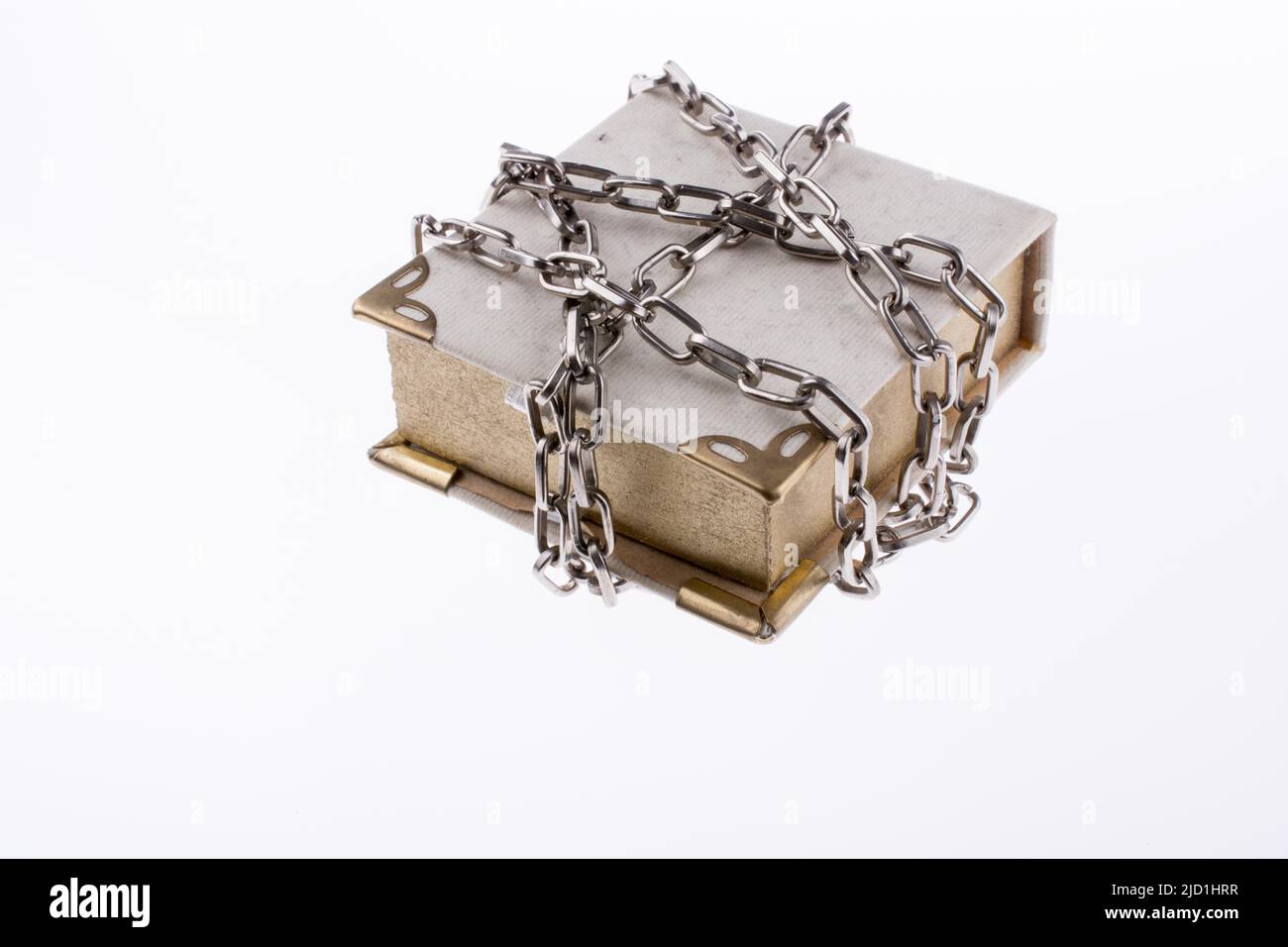 Chained book on white background Stock Photo - Alamy