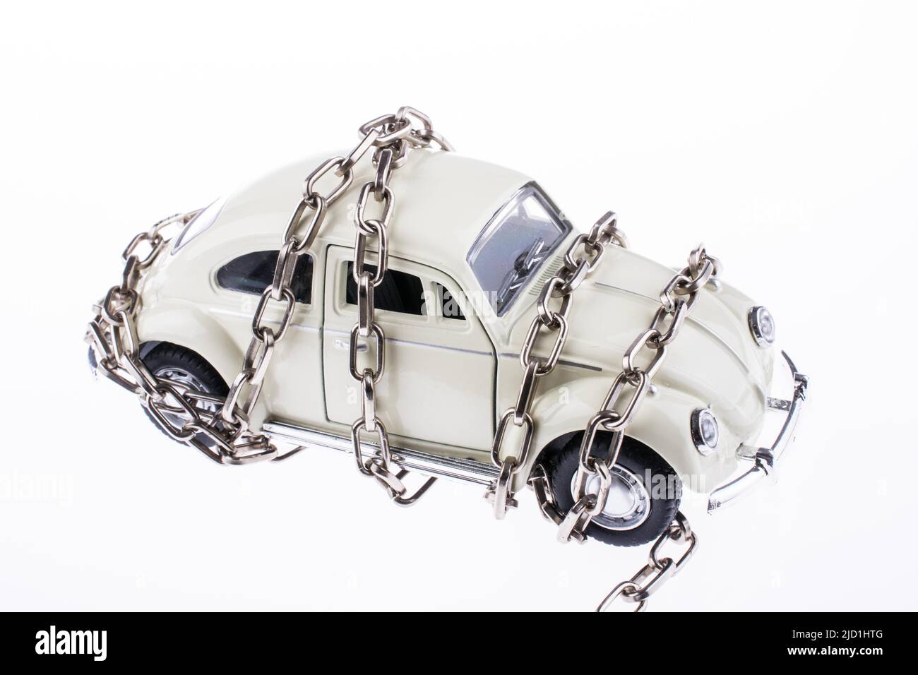 Chained white car on white background Stock Photo - Alamy